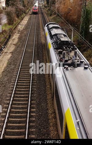 Two trains parked closely on parallel tracks Stock Photo - Alamy