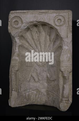 Niche carved on a fragment of the shaft of a Roman column. Decorated ...