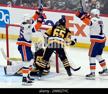 New York Islanders' Simon Holmstrom (10) drives past New York Rangers ...