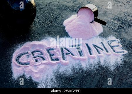 Word creatine written on strawberry creatine powder with a heart ...
