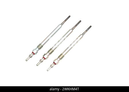 Ceramic glow plugs for a diesel engine in a hand against a background ...