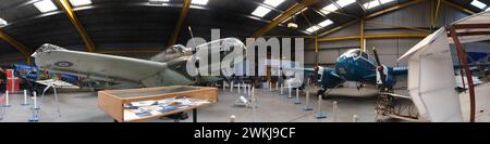 Displays of aircraft, weapons and ancillary equipment inside museum ...