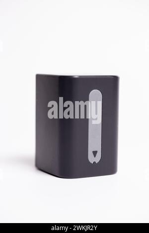 Black rectangular camera battery isolated on white background. The ...
