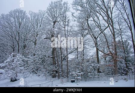 Snow covers the ground as shadows fall on the River Ness. Inverness ...