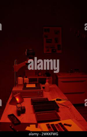 darkroom interior with red light, showcasing the process of film ...