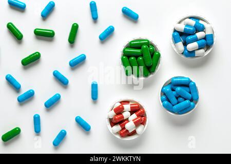Multicolored medical capsules on a blue background. High quality photo ...