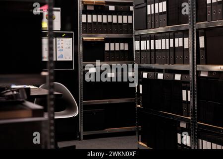 Evidence room equipped with metallic shelves full with federal ...