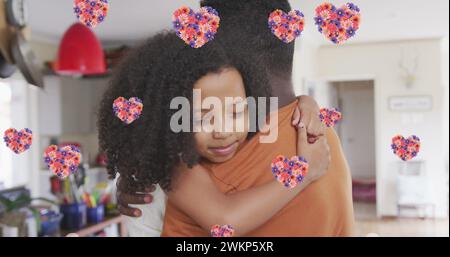 Image of flower hearts over happy african american father and daughter ...