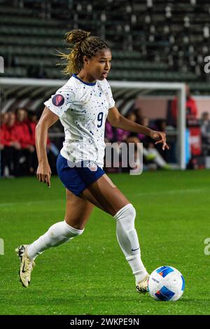 United States forward Midge Purce (9) wins a header against Dominican ...