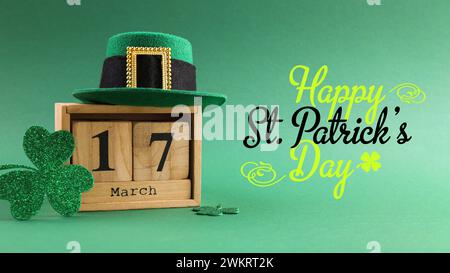 Leprechaun hat and calendar with date of St. Patrick's Day on green ...
