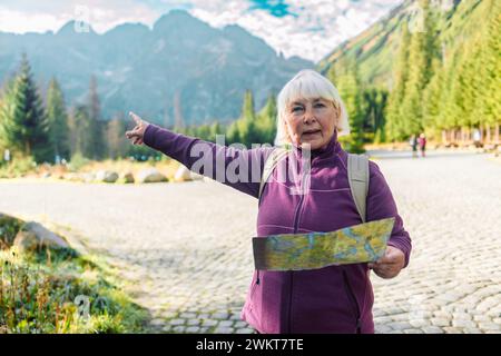 Adventurous woman navigating with a topographic map in beautiful ...