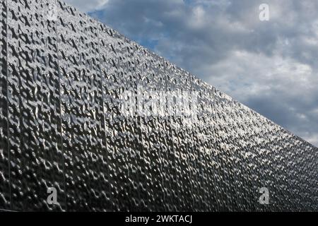 Metal building facades that mimic the texture of rippling water ...