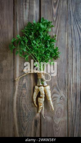 bunch of white parsley roots on white background Stock Photo - Alamy