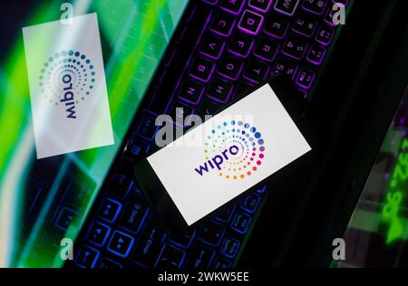In this photo illustration, the Wipro logo is seen displayed on a ...