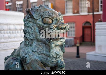 Lion monument at the foot of the Chinese Arch in Chinatown Liverpool ...