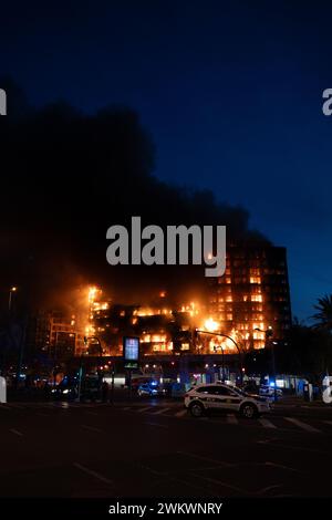 Police cordon off the area as rescue workers search for survivors at ...