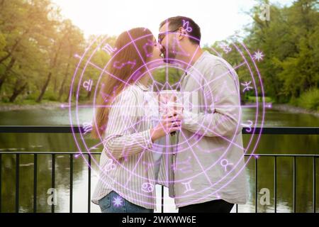 Drawn Zodiac signs and young kissing couple outdoors. Love ...