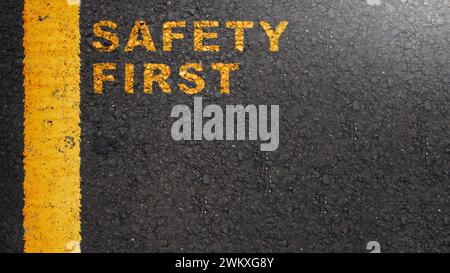 'Safety first' text on the asphalt road. Safety first concept Stock ...