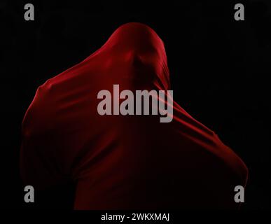 Scary, person and trapped in fabric for horror, art and drama on black ...