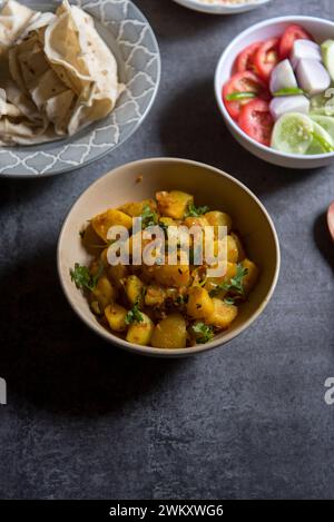 Indian dish aloo jeera or potato saute with cumin and coriander. Aloo ...