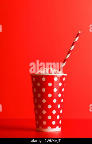 Paper cup with cola and ice over red background, with copy space Stock ...