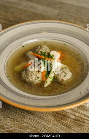 Goose soup, consommé with dumplings and vegetables Stock Photo - Alamy