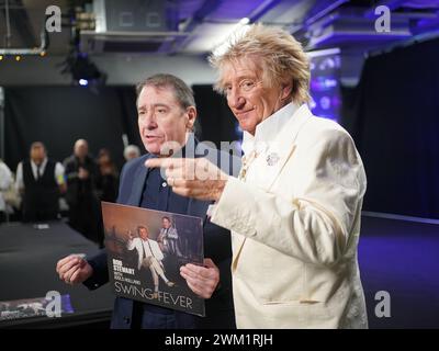 Jools Holland (left) and Rod Stewart during a signing session for their ...