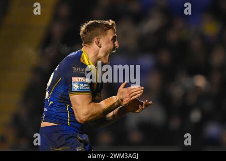 Sam Powell of Warrington Wolves celebrates his try during the Betfred ...