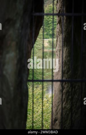 Stone dungeon with barred windows Stock Photo - Alamy