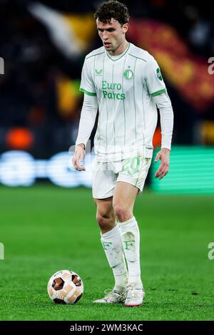 Feyenoord's Dutch midfielder Mats Wieffer challenges for the ball with ...