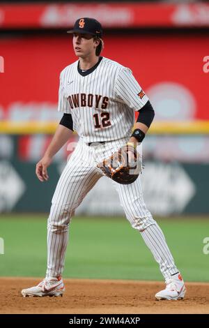 Oklahoma State first baseman Colin Brueggemann (12) catches the throw ...