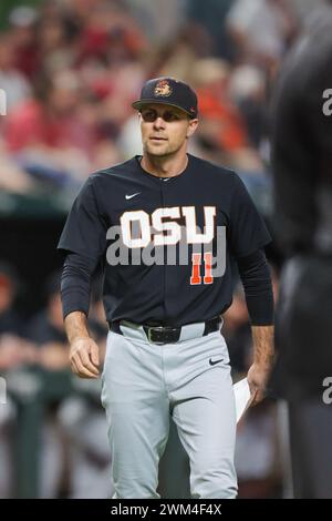 Oregon State head coach Mitch Canham looks at his dugout before playing ...