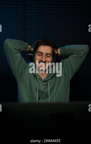 Male gamer engaging with the online gaming world. With a headset ...