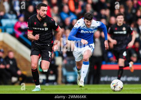 Gillingham's Ashley Nadesan battles for the ball against Wrexham's Eoghan O'Connell during the ...
