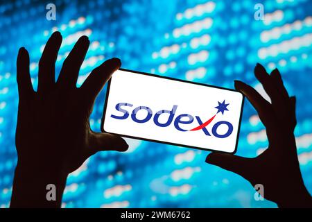 In this photo illustration, the Sodexo logo is displayed on the screen ...