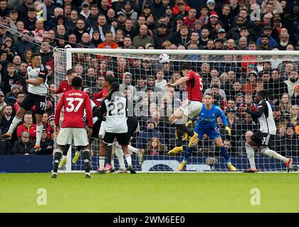 Harry Maguire of Manchester United heads on goal and hits the crossbar ...