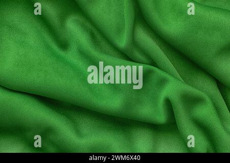 A crumpled green fabric background. Close up Stock Photo - Alamy