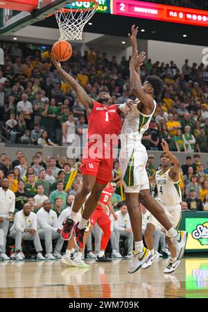 Houston guard Jamal Shead (1) shoots the ball against Bryant during the ...