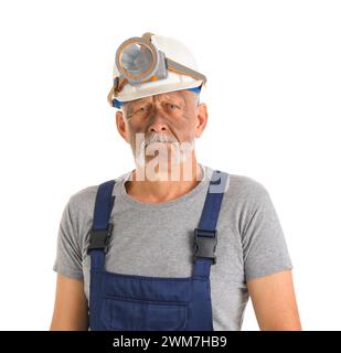 Mature miner man with headlamp on grey background Stock Photo - Alamy