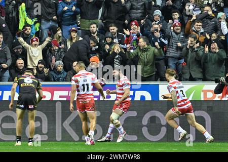 Wigan Warriors' Abbas Miski celebrates scoring his side's fourth try of ...