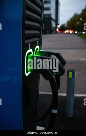 Two charging handles of an electric car charger Stock Photo - Alamy
