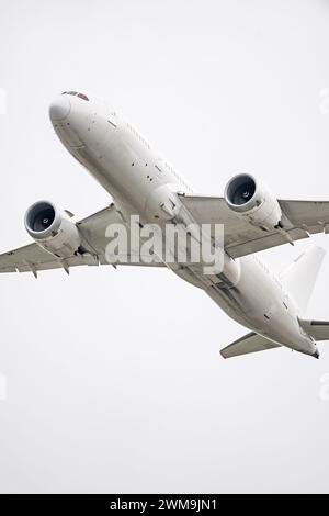 Fuselage of a completely white passenger plane with two jet engines ...