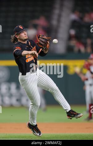 February 24, 2024: Arkansas infielder Wehiwa Aloy #9 charges a bouncing ...