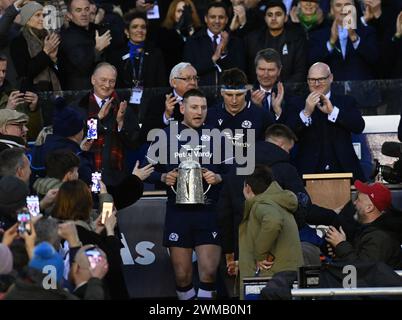Scotland's Finn Russell and Rory Darge (left) hold the Cuttitta Cup ...