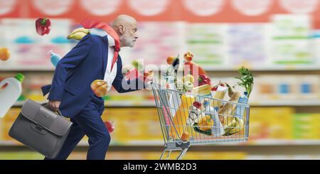 Fast businessman running and pushing a supermarket shopping cart Stock ...