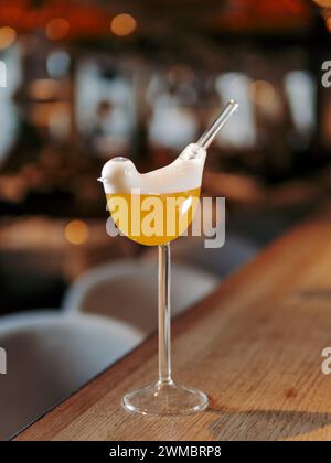 Glass of Yellow Bird Cocktail with fresh orange Stock Photo - Alamy