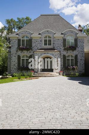 Large French Manor style natural stone home with three car garage and ...
