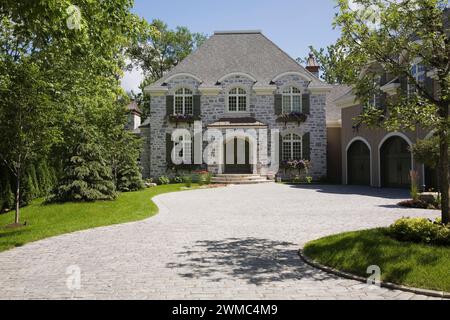 Large French Manor style natural stone home with three car garage and ...