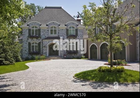 Large French Manor style natural stone home with three car garage and ...