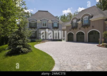 Large French Manor style natural stone home with three car garage and ...